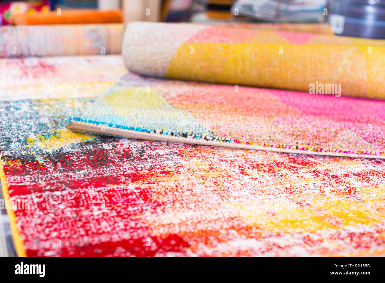 diversity of colour carpets in the store for home decor Stock Photo - Alamy
