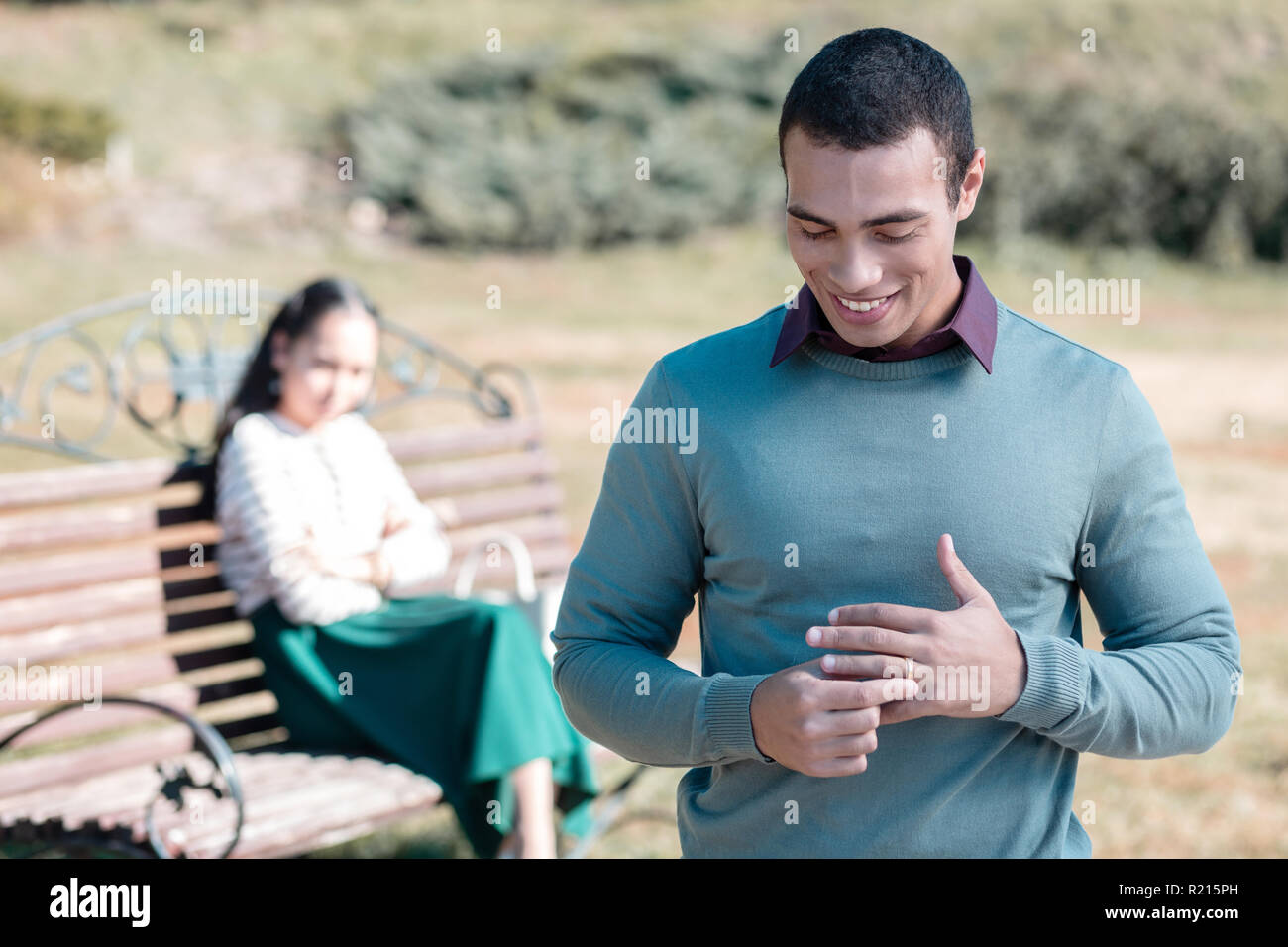 Kind male person keeping smile on his face Stock Photo - Alamy