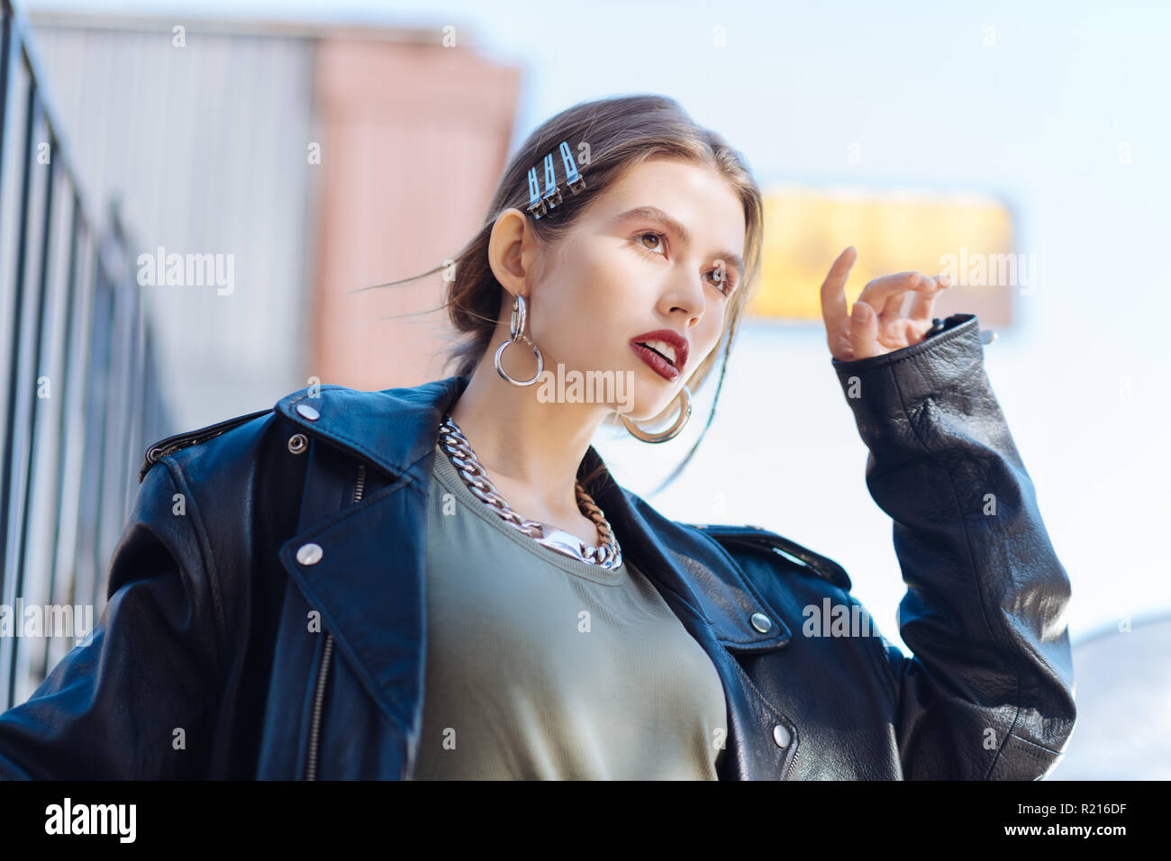 Appealing fashion model with light pink eye shades and bright lips ...