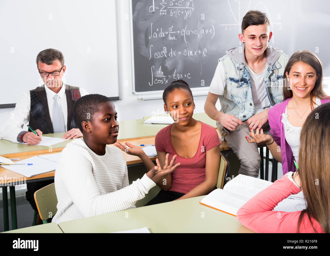 many kids taking a rest together indoors Stock Photo - Alamy
