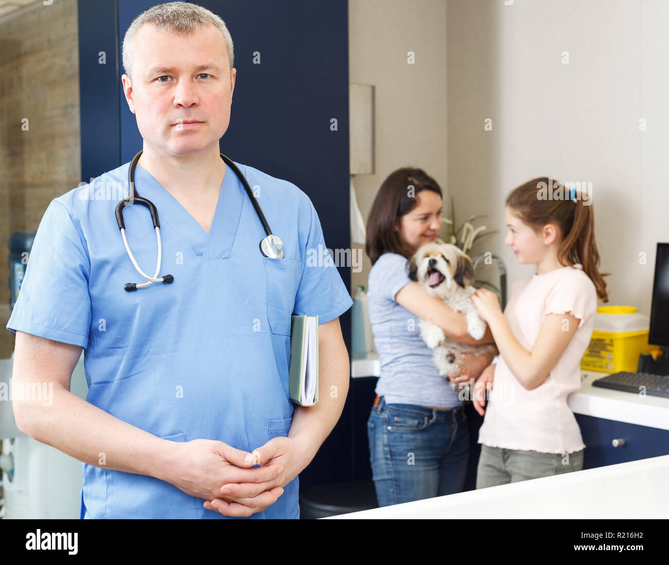 Portrait of professional man veterinarian posing at modern vet clinic ...