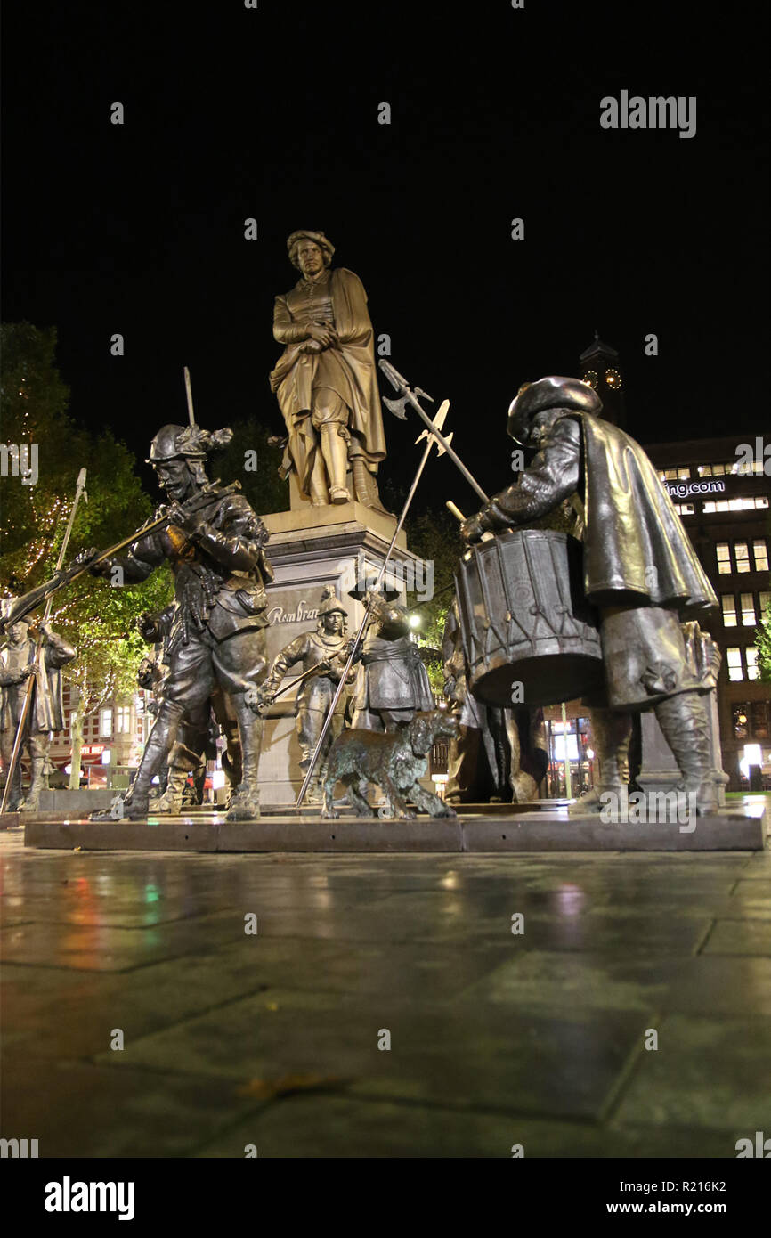 The Rembrandt statue at night on Rembrandtplein (Rembrandt Square) is ...