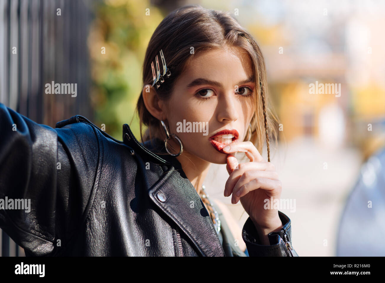 Fashionable photo model wearing khaki shirt and leather jacket Stock ...