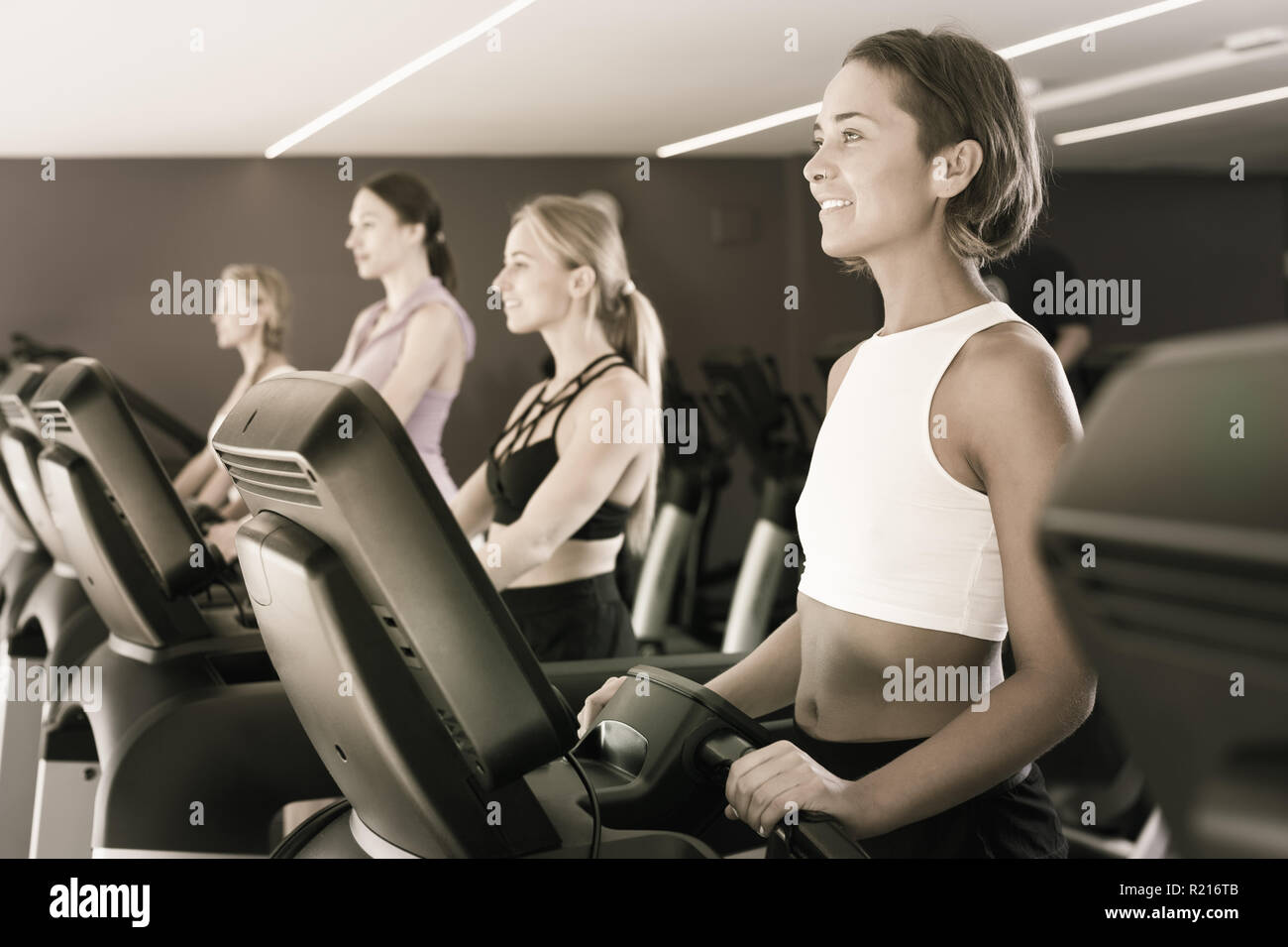 Female running on treadmills hi-res stock photography and images - Alamy