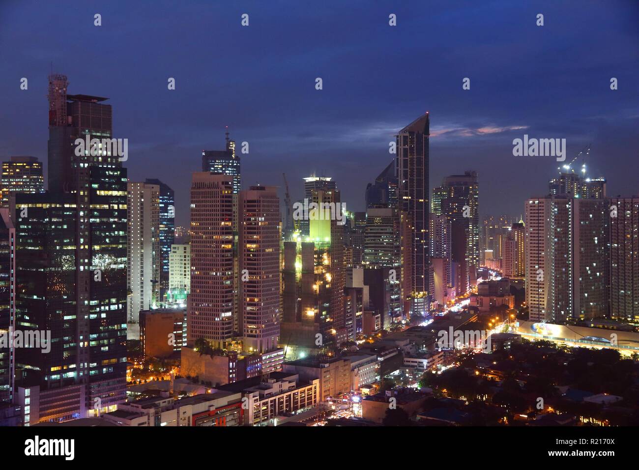 Makati city night skyline in Manila, Philippines. Office buildings Stock Photo - Alamy