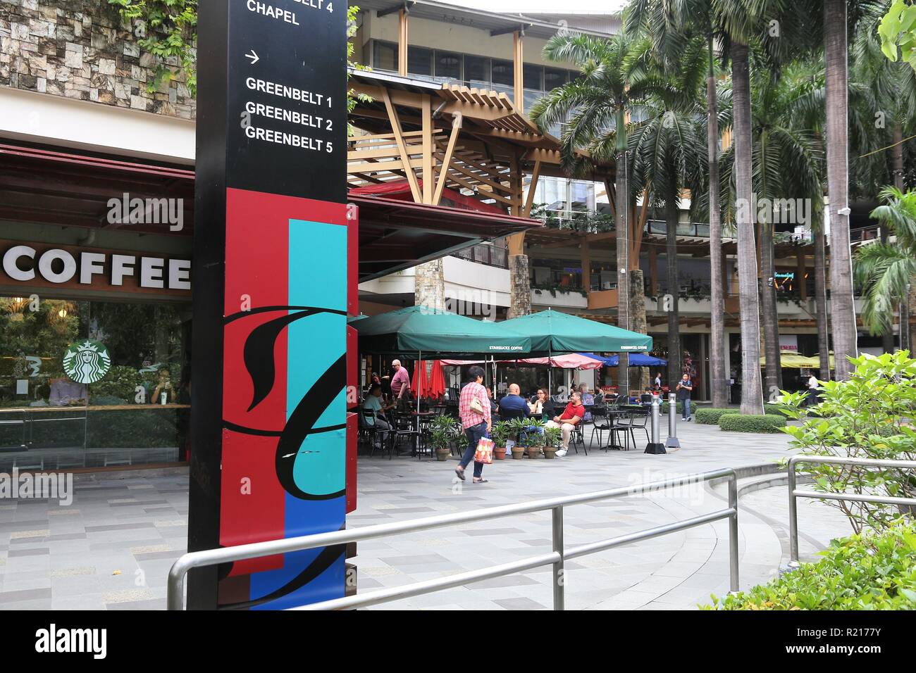 MANILA, PHILIPPINES - NOVEMBER 28, 2017: People visit Greenbelt shopping center in Makati City ...