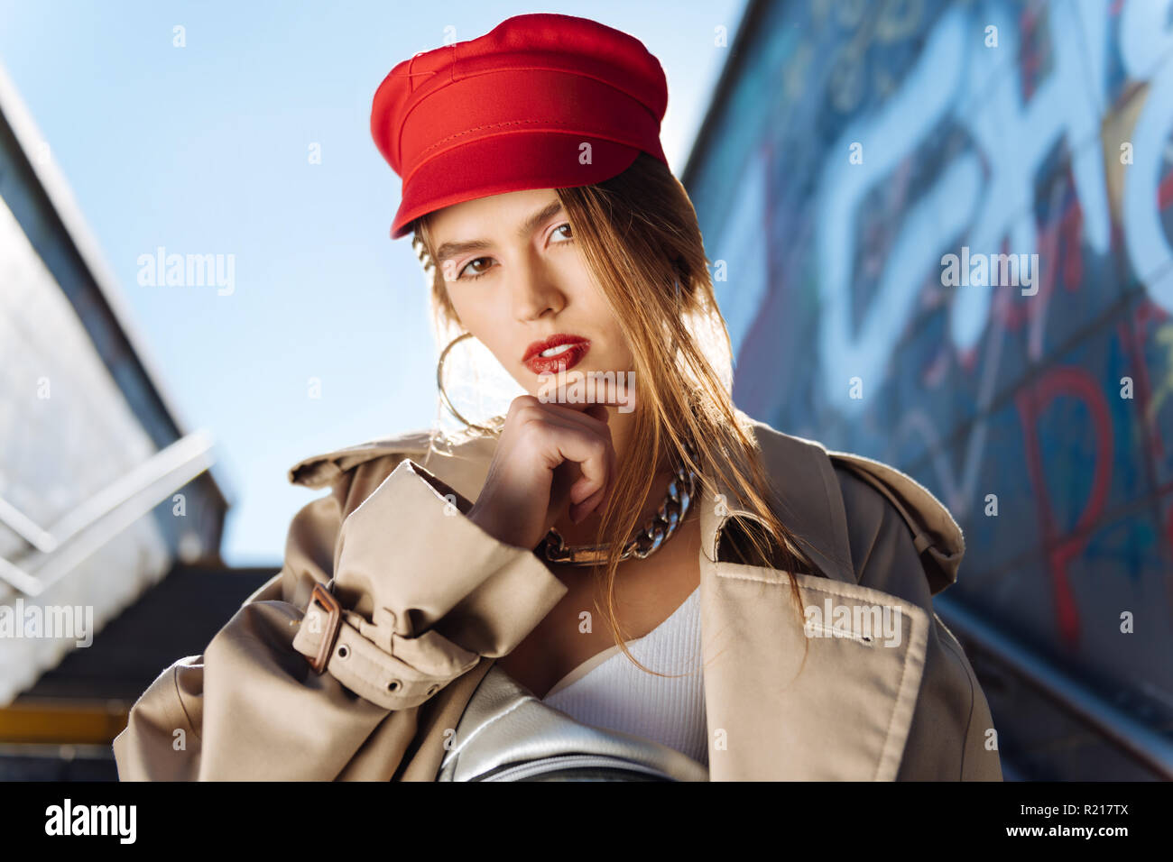 Famous model posing for magazine cover standing on the stairs outside ...