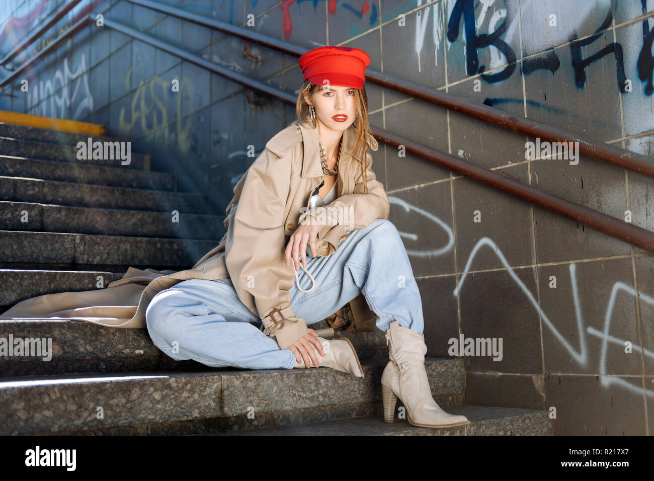 Famous model posing for the magazine cover in beige high-heeled boots ...