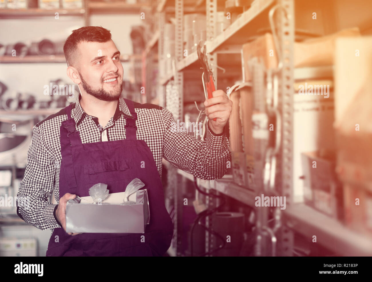Man worker showing his constructing tools at workplace Stock Photo - Alamy