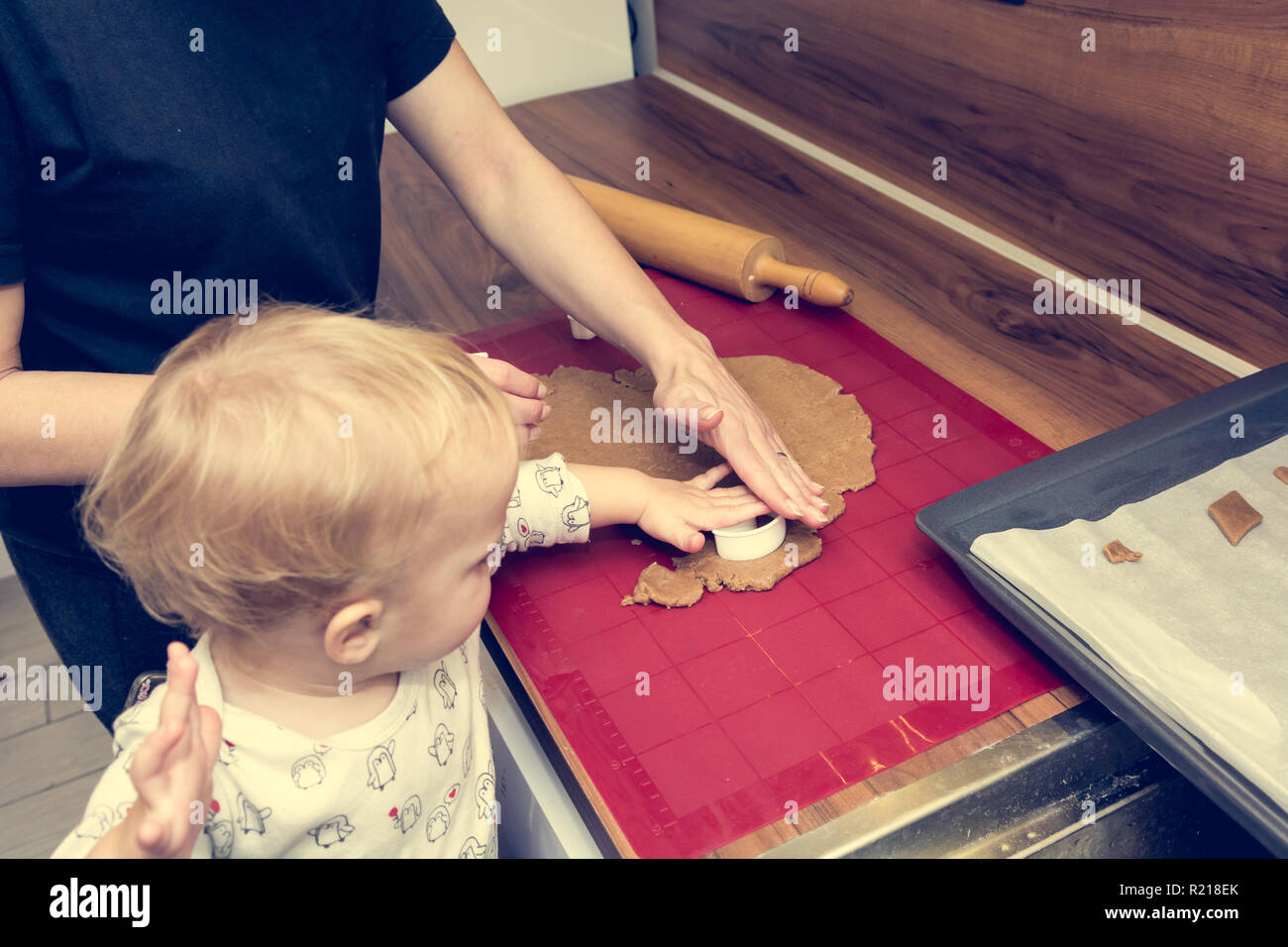 Child learning how to make cookies at home Stock Photo - Alamy