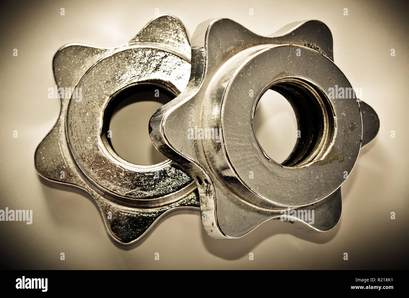 two shiny metal nuts closeup Stock Photo - Alamy