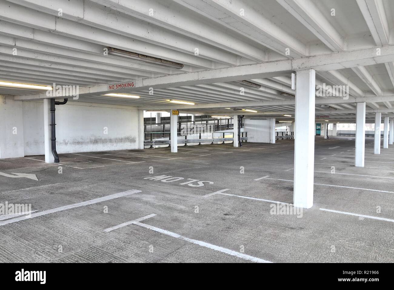 Multi-storey car park interior. Generic parking garage in England Stock ...