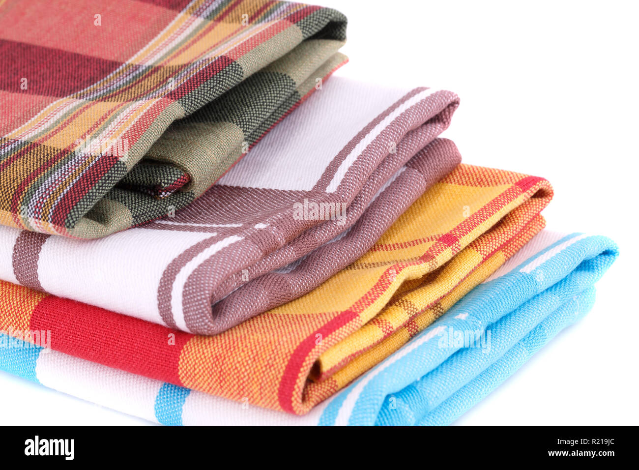 Stack of colorful kitchen towels on white background Stock Photo - Alamy