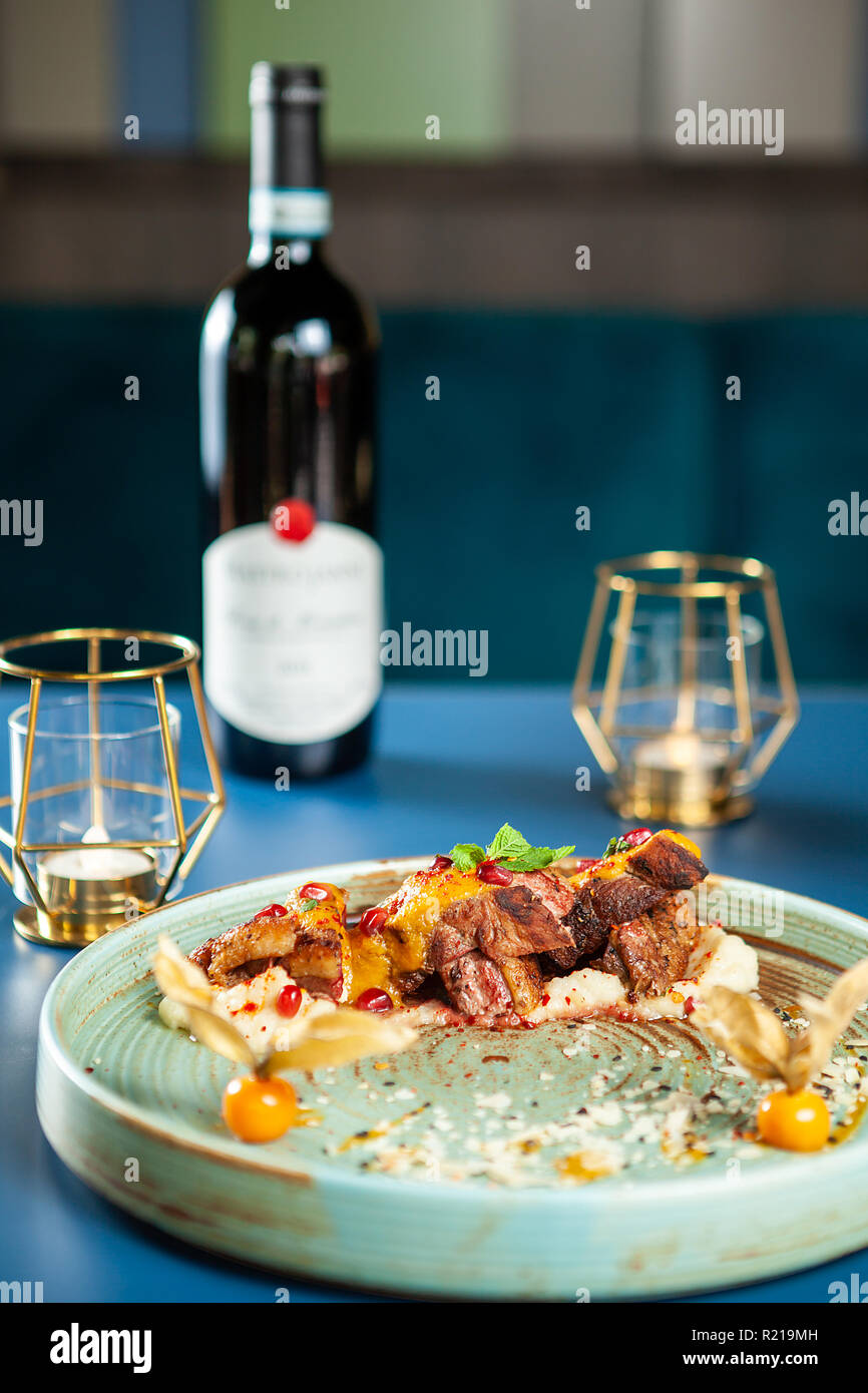 Fine dining design in restaurant with good red wine. Tasty gastronomy ...