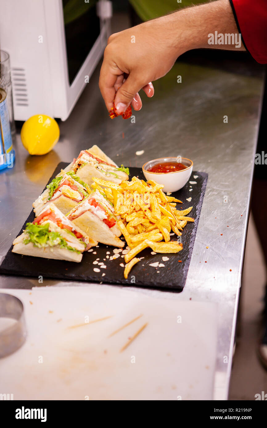 Chef making sandwich desing on stone plate. Restaurant cuisine Stock ...