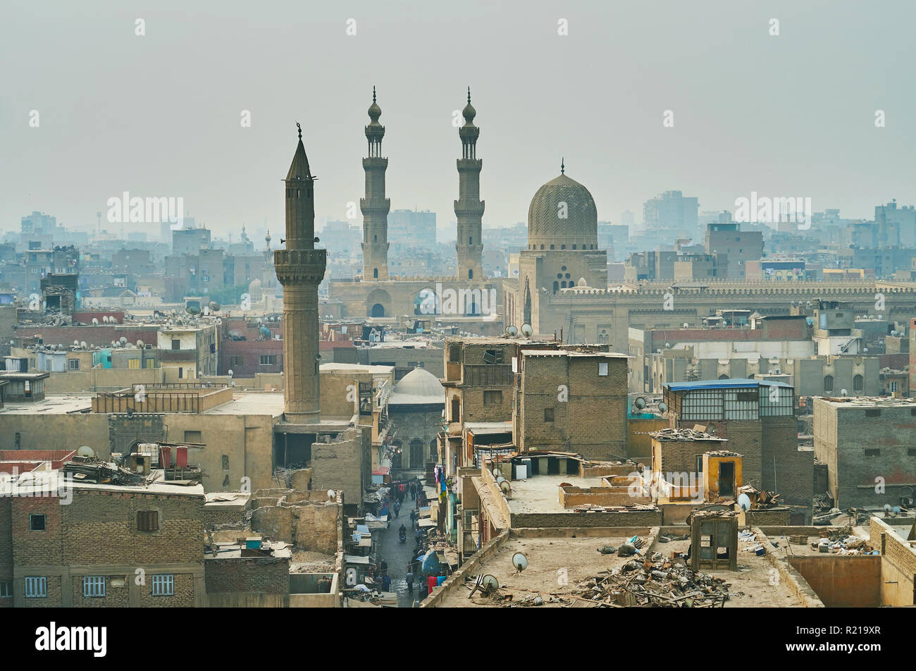 The old minaret of Al-Fakahany Mosque, the tall twin towers of Bab ...