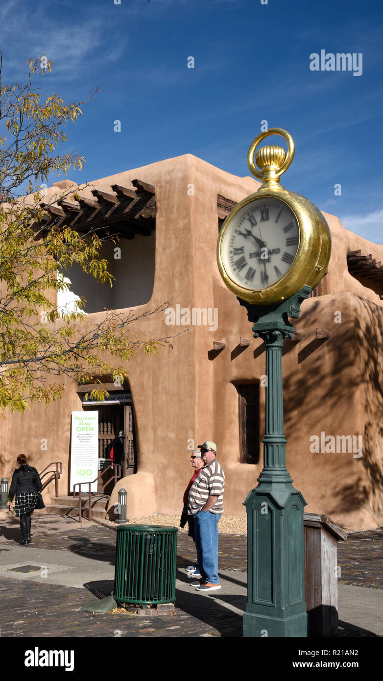 A vintage street clock, or post clock, in front of the New Mexico ...