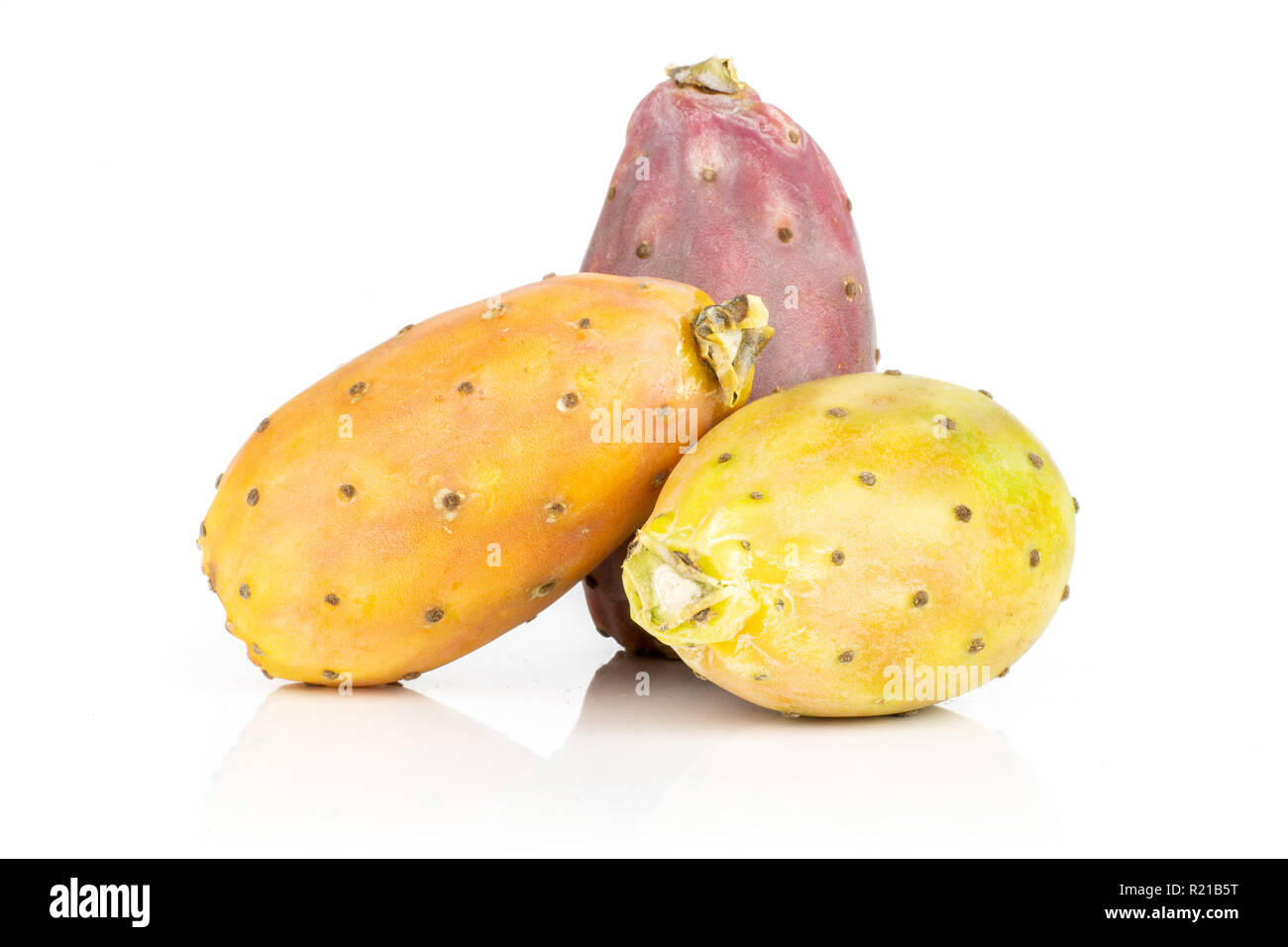 Group of three whole orange yellow red fresh bright prickly pear ...