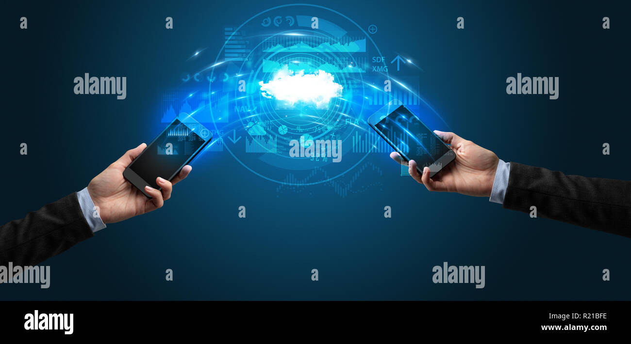 Two mobile phones syncing through the cloud Stock Photo - Alamy