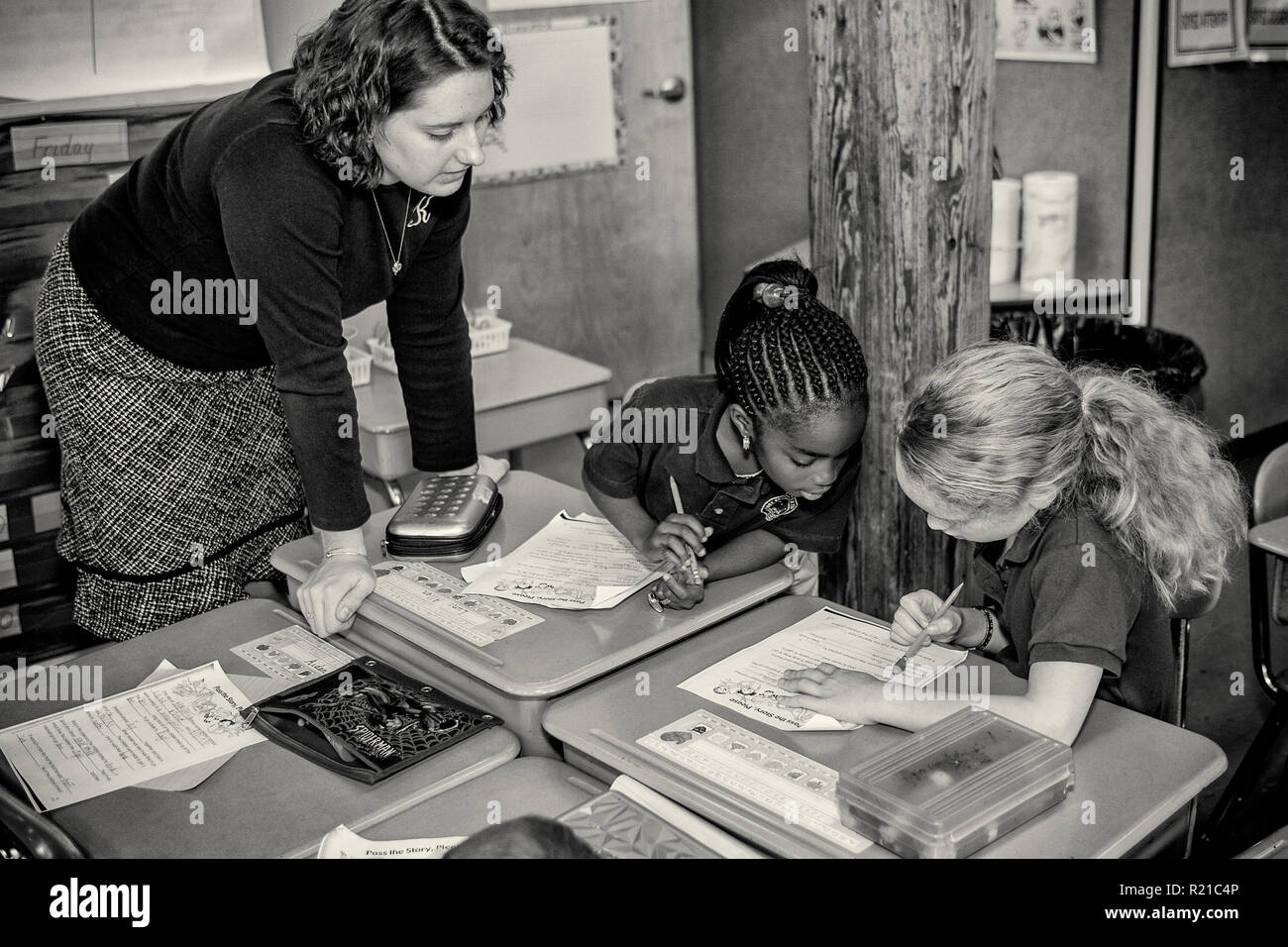 White teacher helping black student hi-res stock photography and images ...