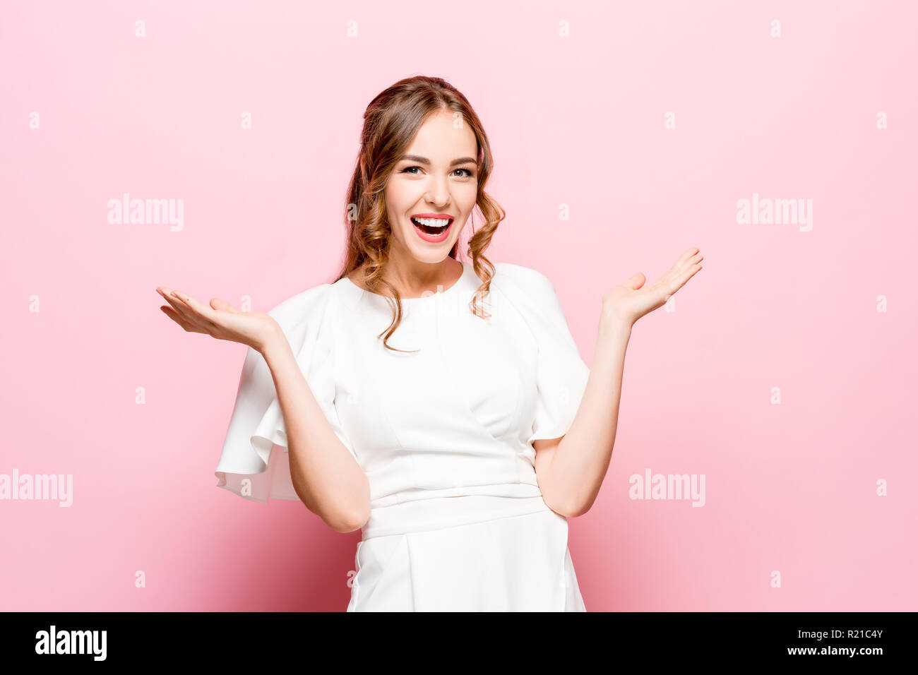 Delight. Beautiful female half-length front portrait isolated on pink ...