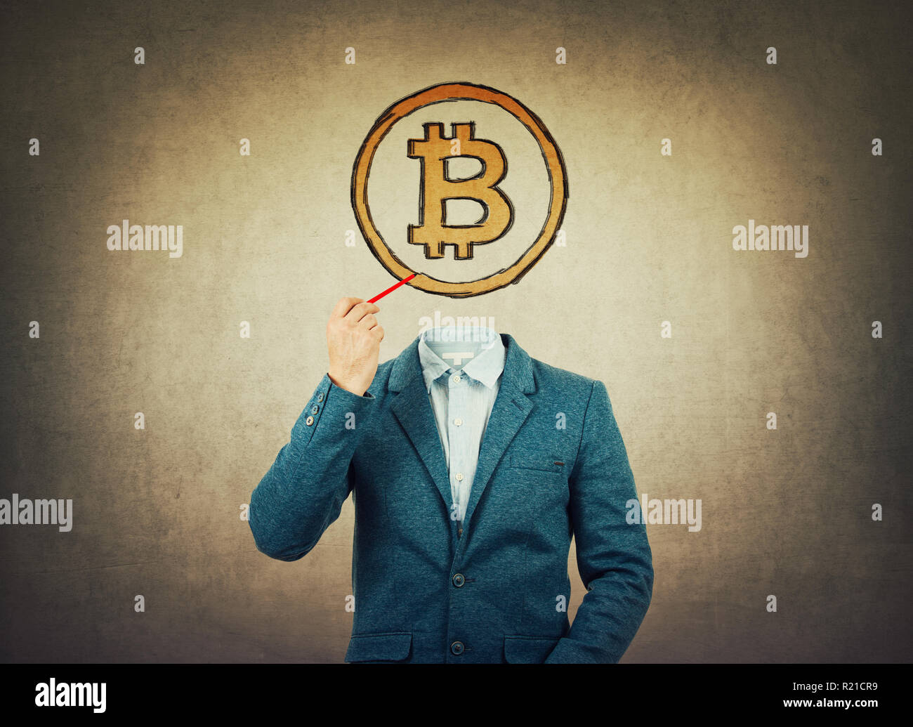 Surreal image as a businessman with invisible face holding a pencil in ...