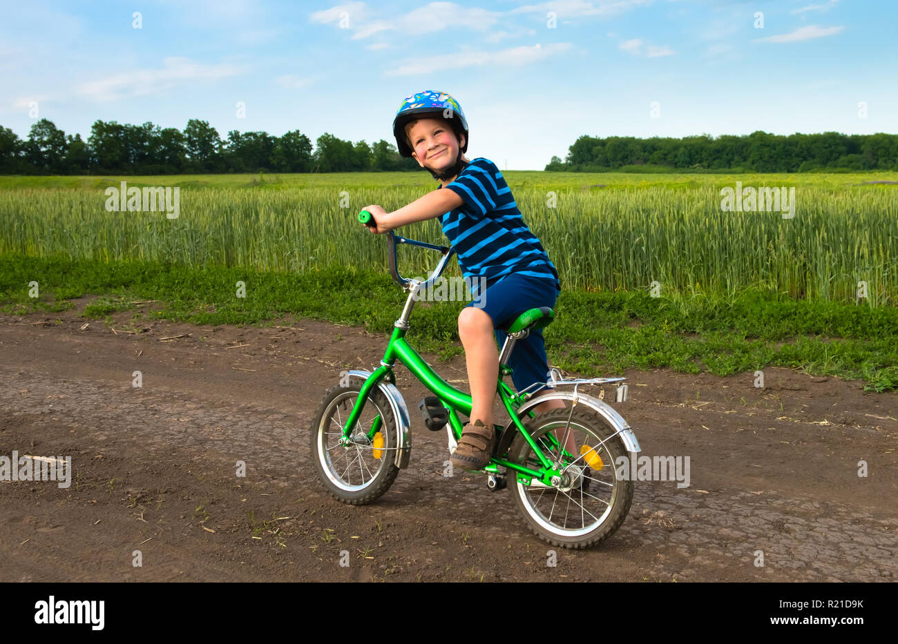 boy on bicycle in rural landscape Stock Photo - Alamy