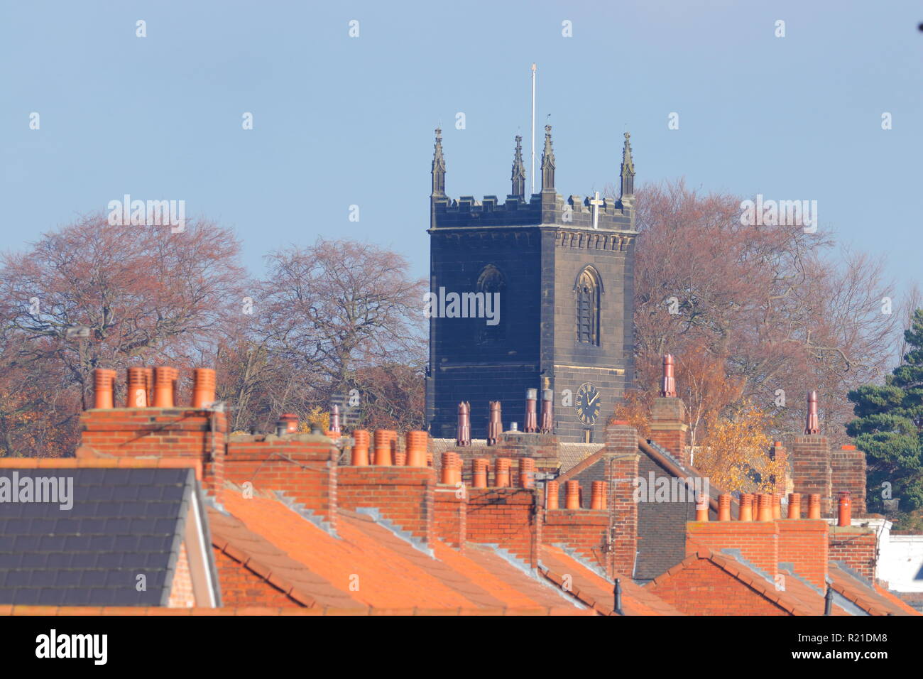 Rooftops of homes in Swillington with St Mary's Church Tower Stock ...