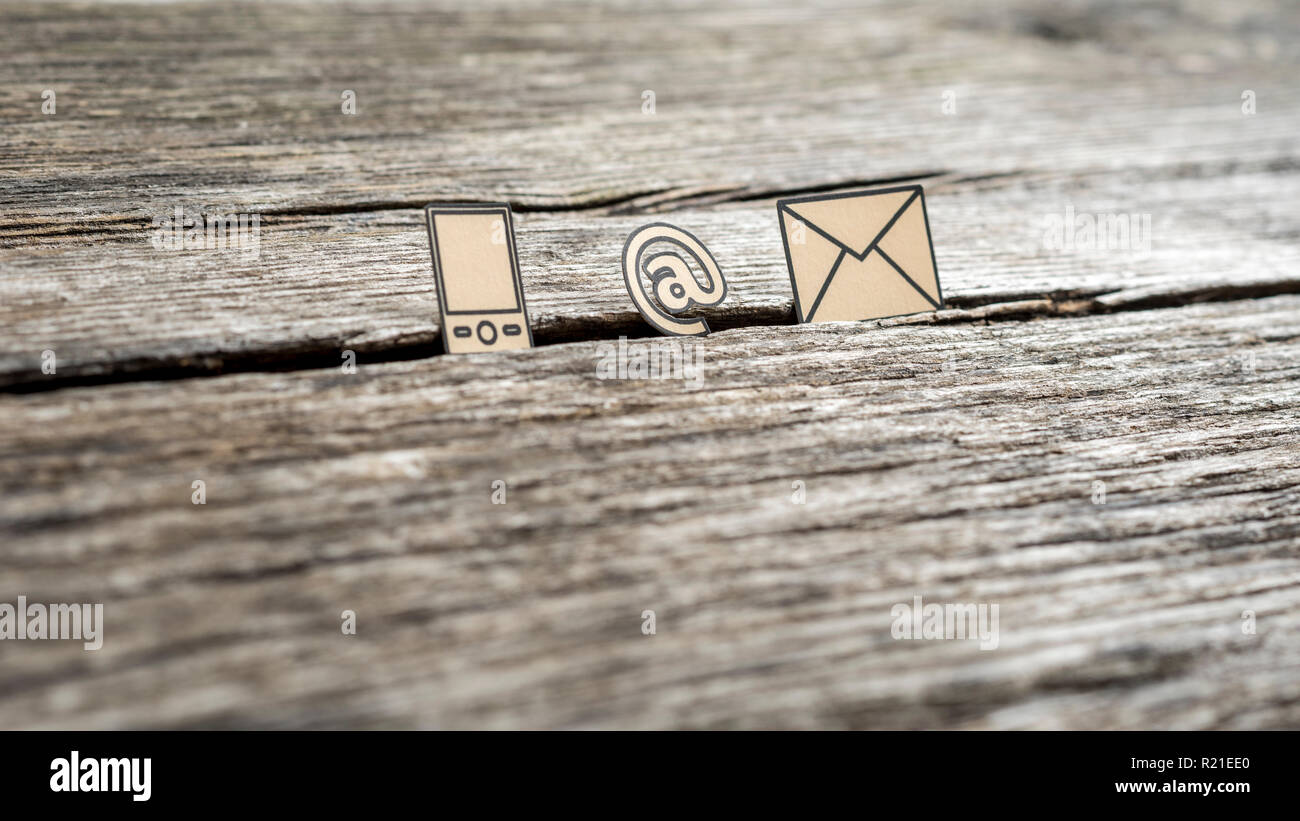 Contact icons at sign, mail and mobile phone outlined with black stuck ...