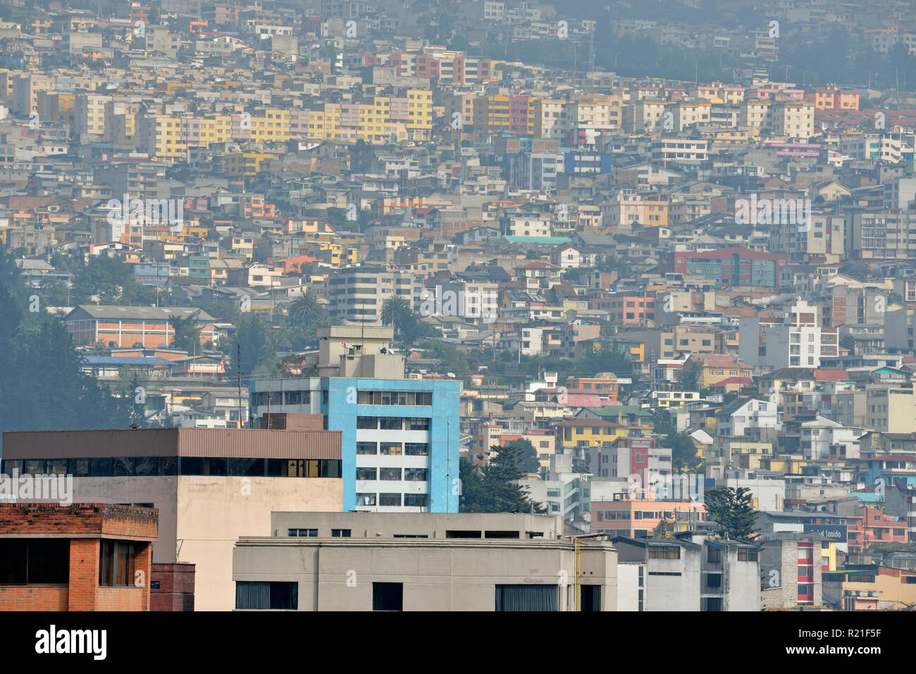 Downtown Quito buildings and the slopes of Pichincha volcano, Quito ...