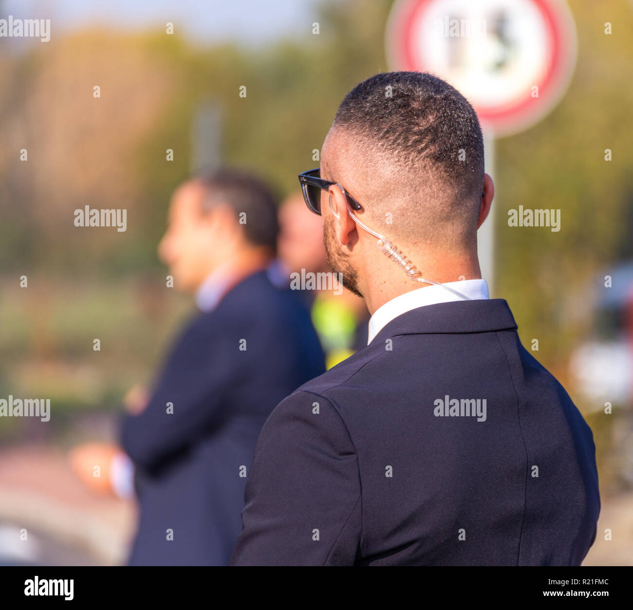 back of Safety Officer with headset Stock Photo - Alamy