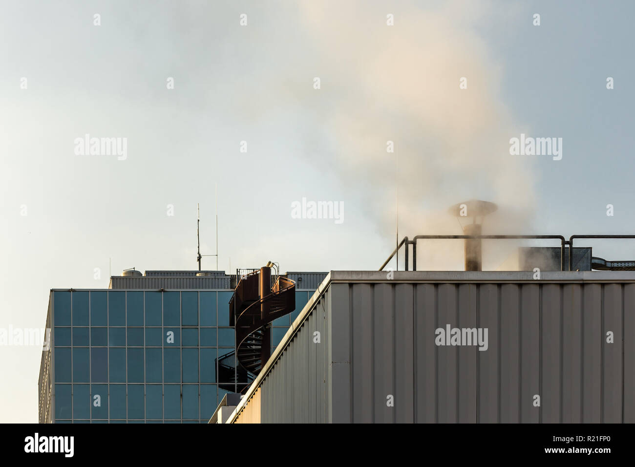 Smoke comes out of a chimney in factory Stock Photo - Alamy
