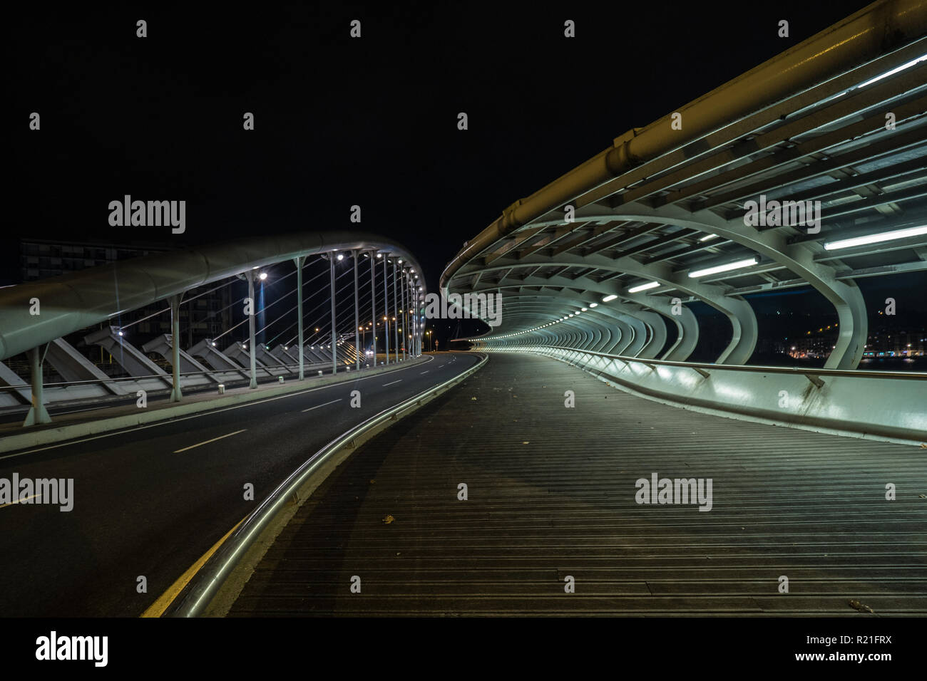 modern white bridge illuminated in blue Stock Photo - Alamy
