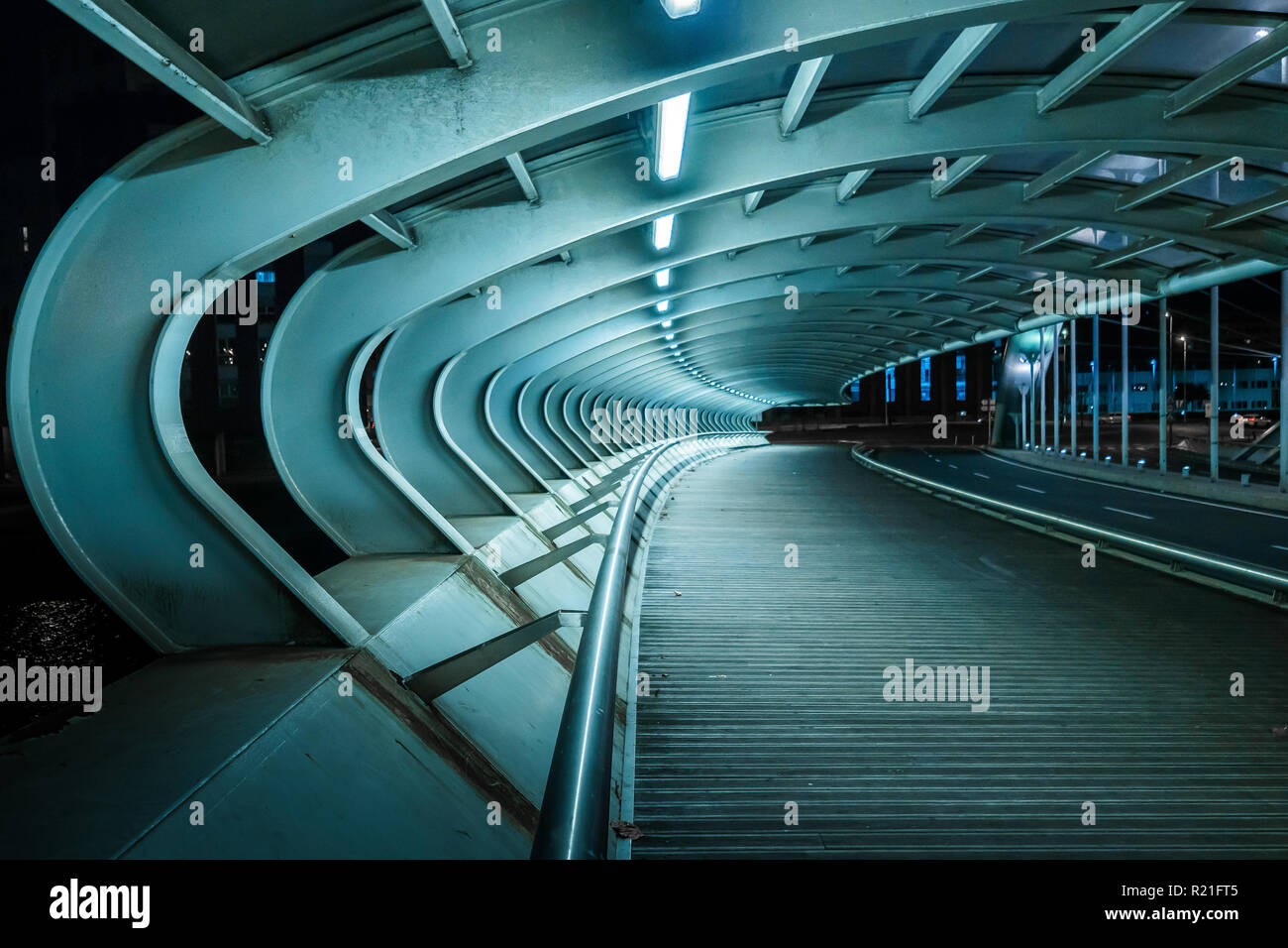 modern white bridge illuminated in blue Stock Photo - Alamy