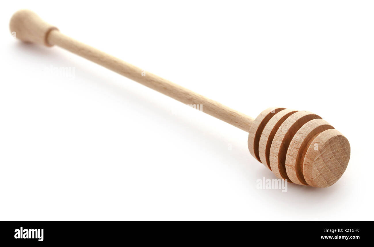 Wooden honey dipper isolated over white background Stock Photo - Alamy