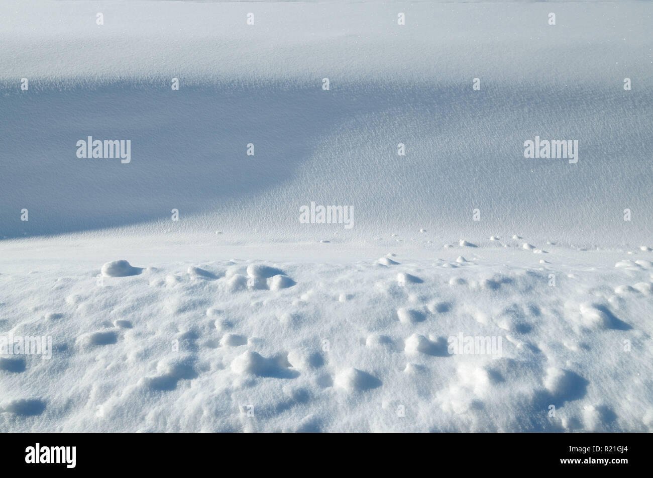 Slanting rays of the sun showing the texture of snow Stock Photo - Alamy