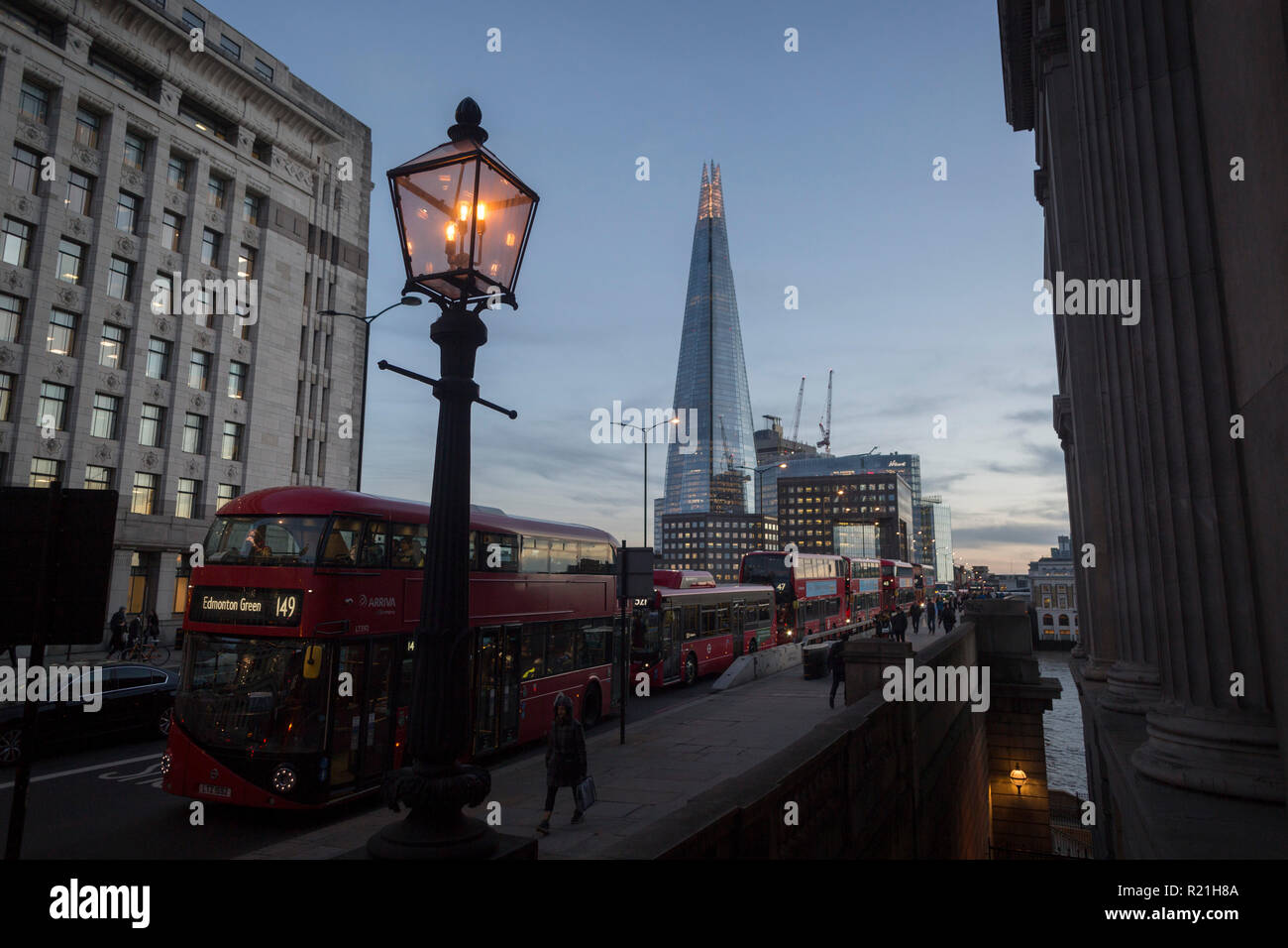 Buses and cars queue on London Bridge during the evening rush-hour, on ...