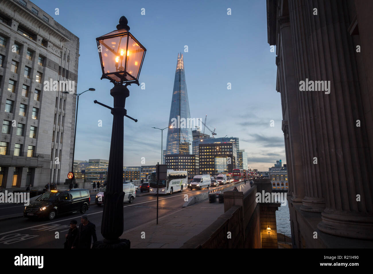 Buses and cars queue on London Bridge during the evening rush-hour, on ...