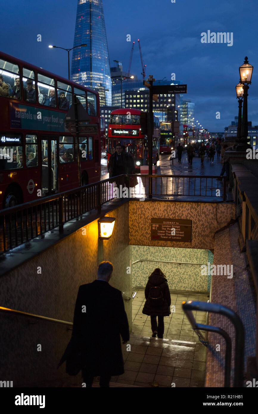 With the Shard in the background, pedestrians descend steps into the ...