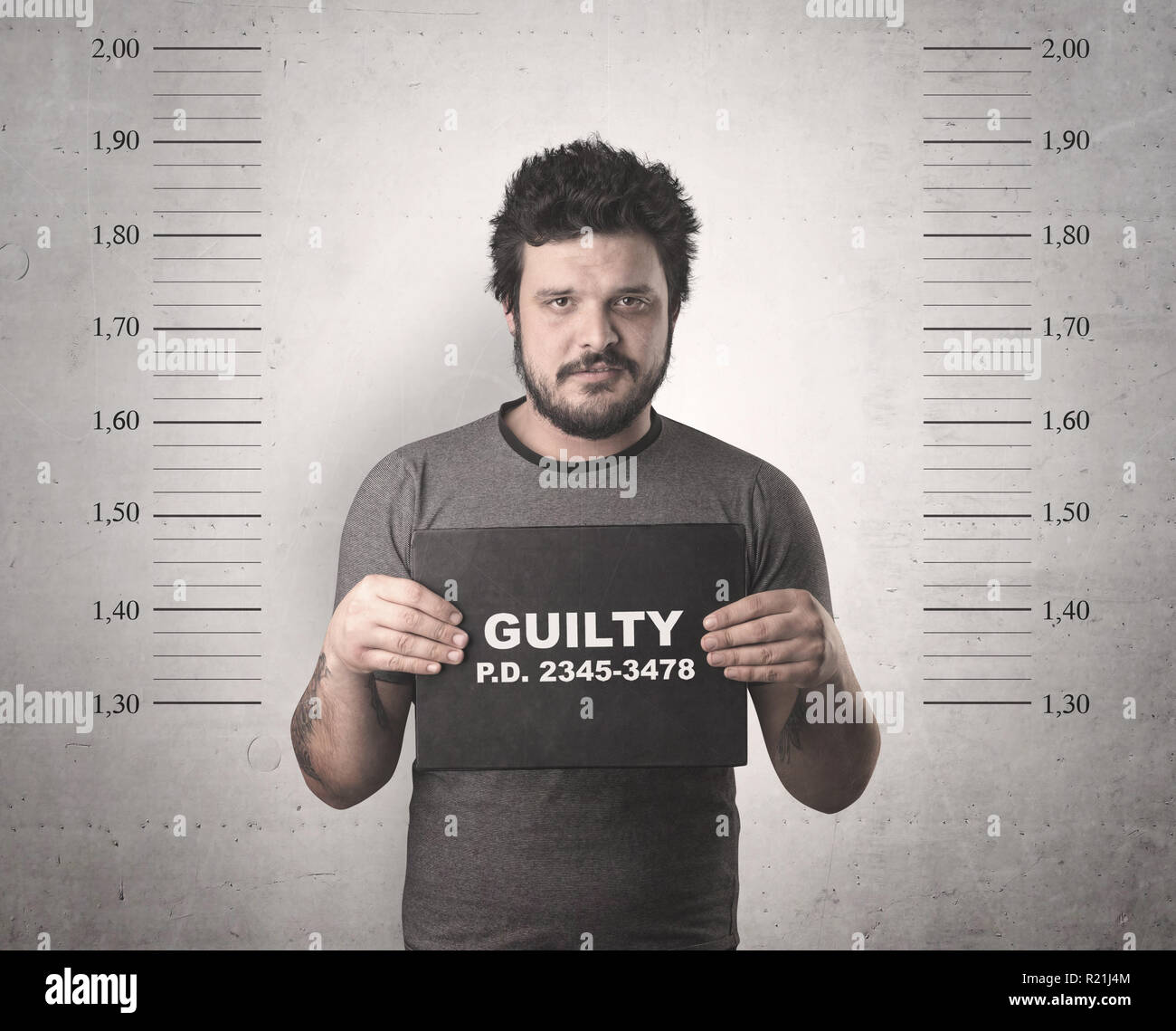 Caught guilty man with ID signs on his hand Stock Photo - Alamy