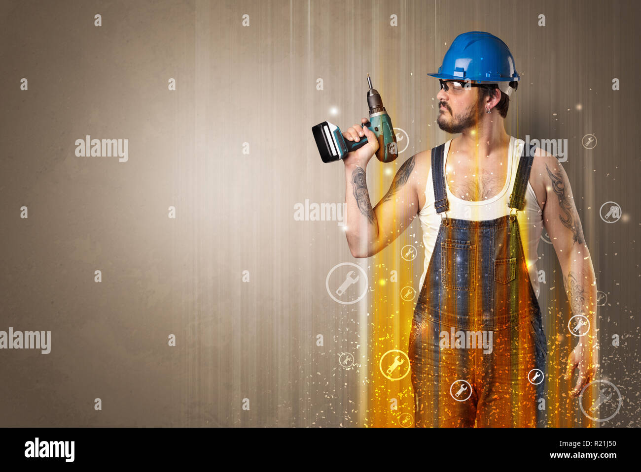 Manual worker with wrench symbols and tool Stock Photo - Alamy