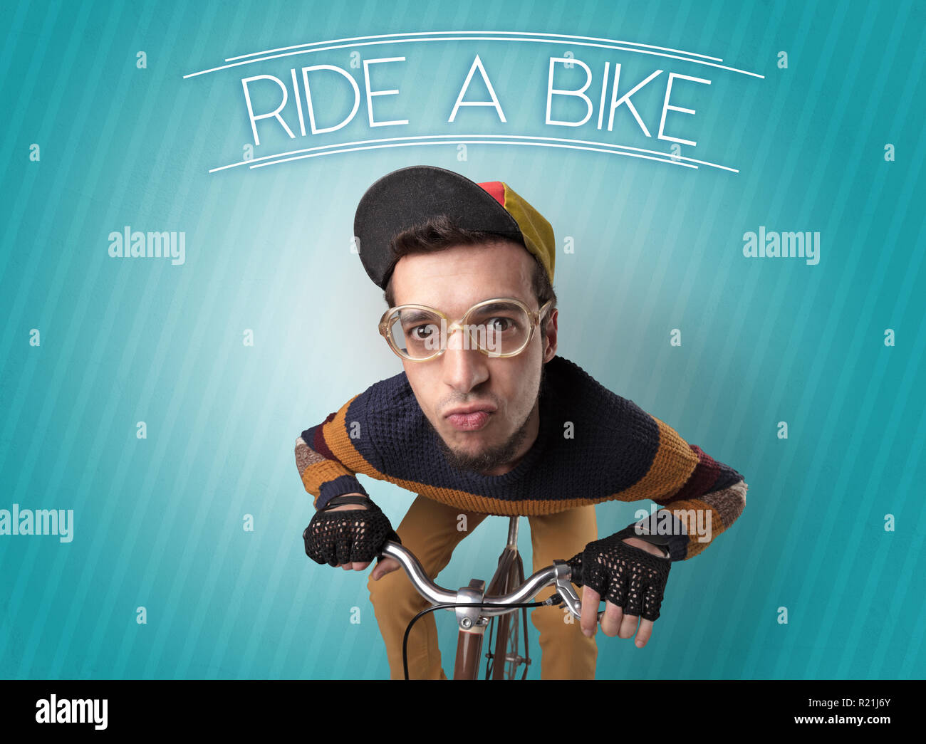 Kooky young guy on a bike with cyclist keywording and streaky ...