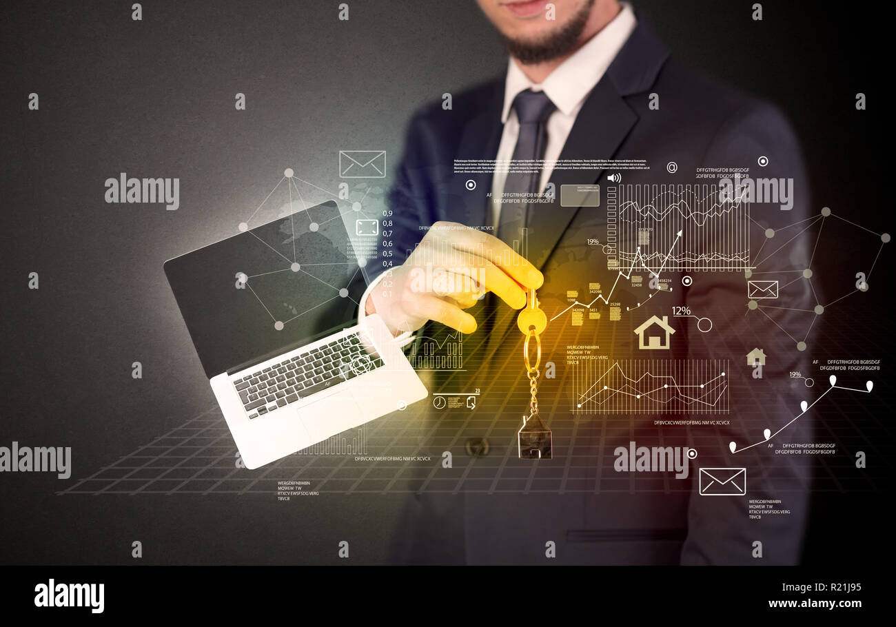 Businessman in suit holding keys with statistics, graphs and icons ...
