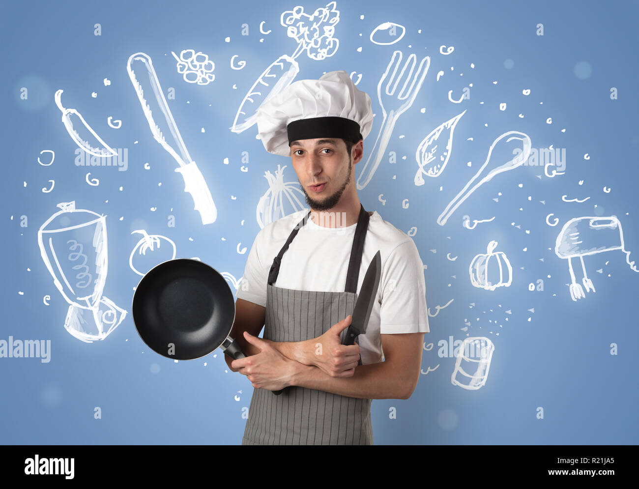Young cook with kitchen instruments and drawn recipe concept on ...