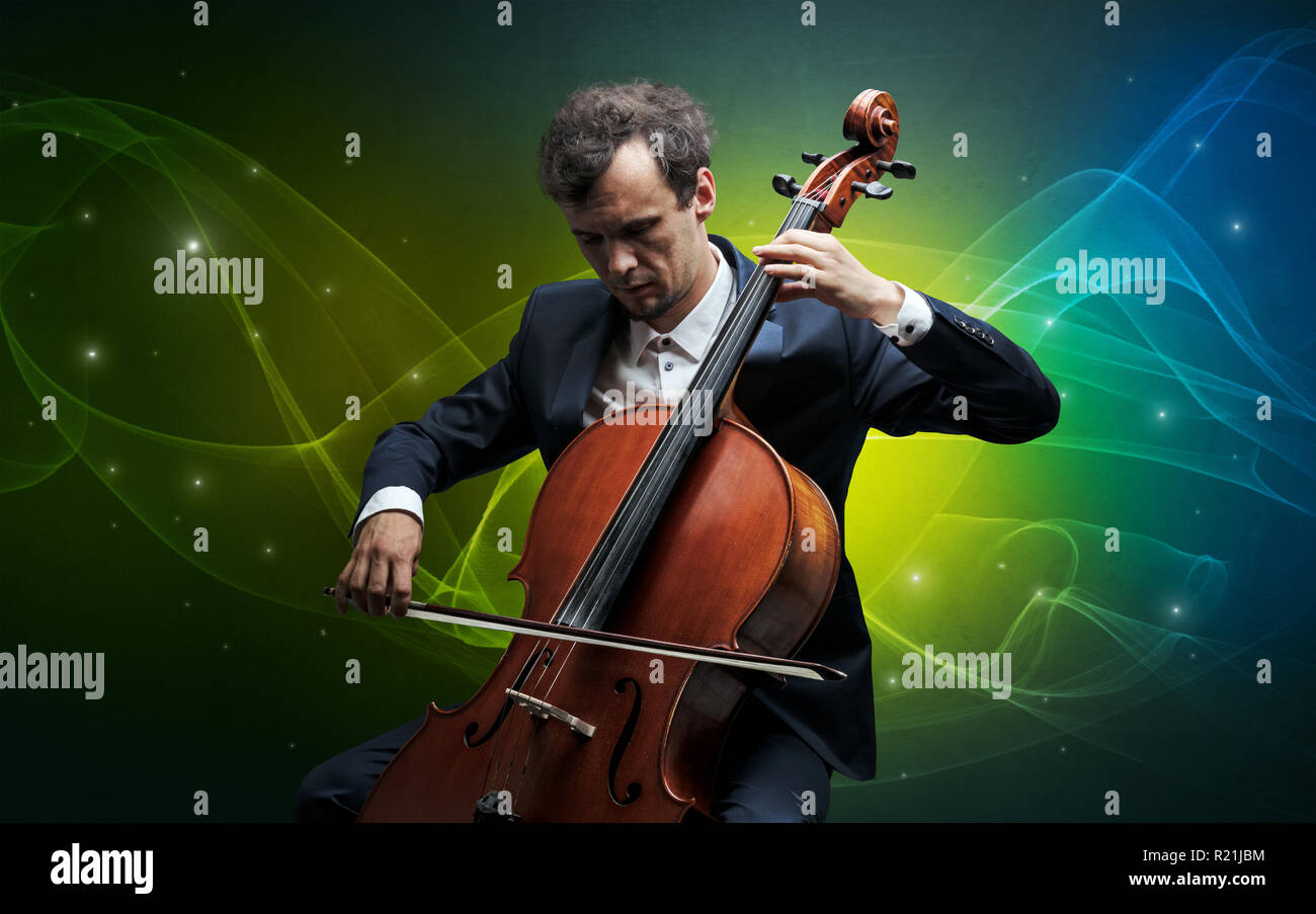 Serious classical cellist with fabled sparkling wallpaper Stock Photo ...
