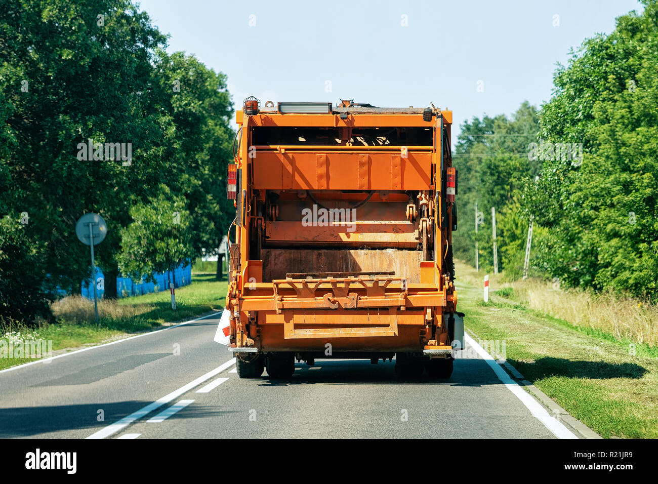 Garbage truck in the road in Poland Stock Photo - Alamy
