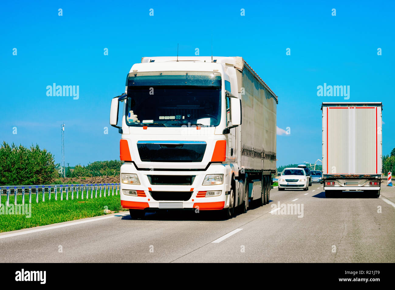 Trucks on the road of Poland. Lorry transport delivering some freight ...