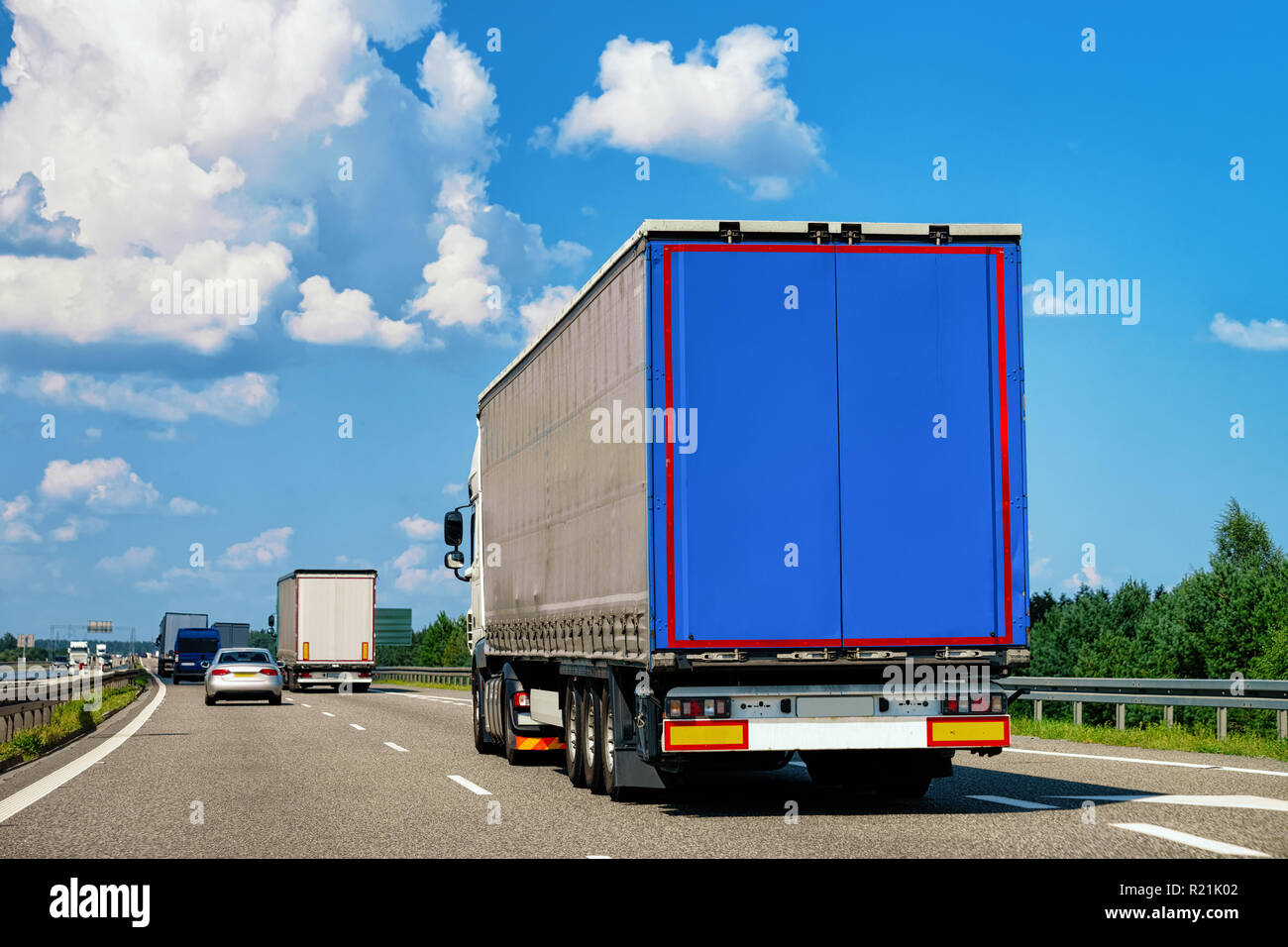 Truck in the road of Poland. Lorry transport delivering some freight ...