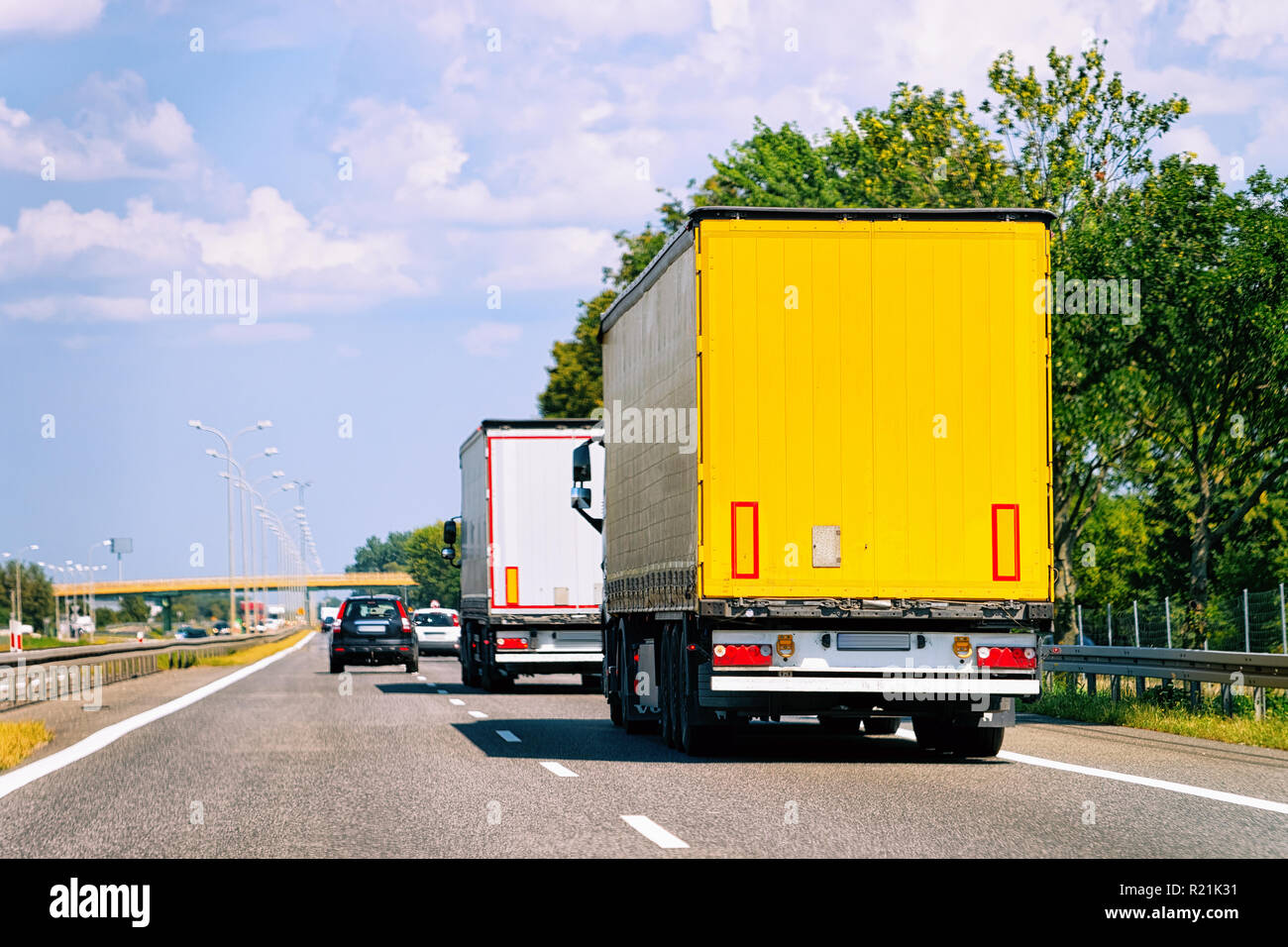 Trucks in the road at Poland. Lorry transport delivering some freight ...