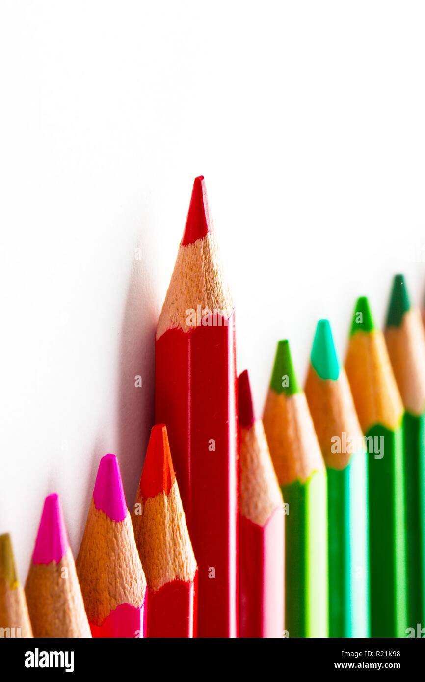 leadership concept with one pencil standing out of crowd of other ...